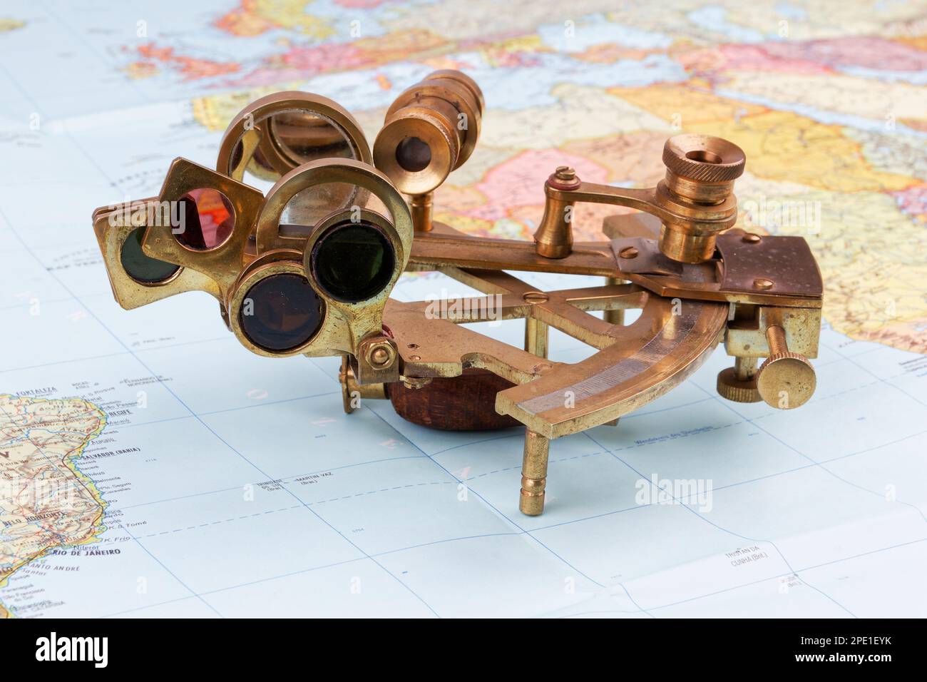 nautical sextant with optics lying on paper world map Stock Photo - Alamy