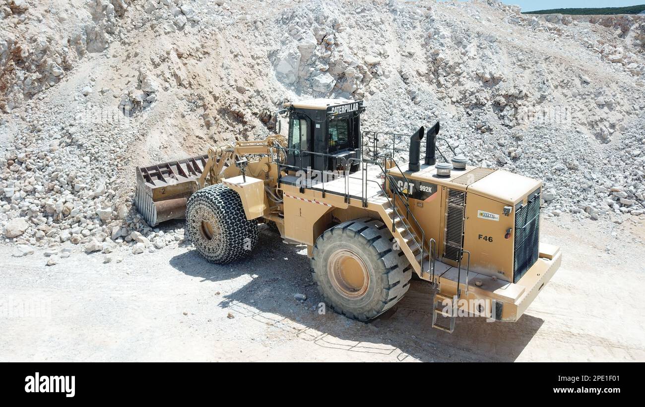 Huge Wheel Loader Working On Huge Mining Site Stock Photo - Alamy