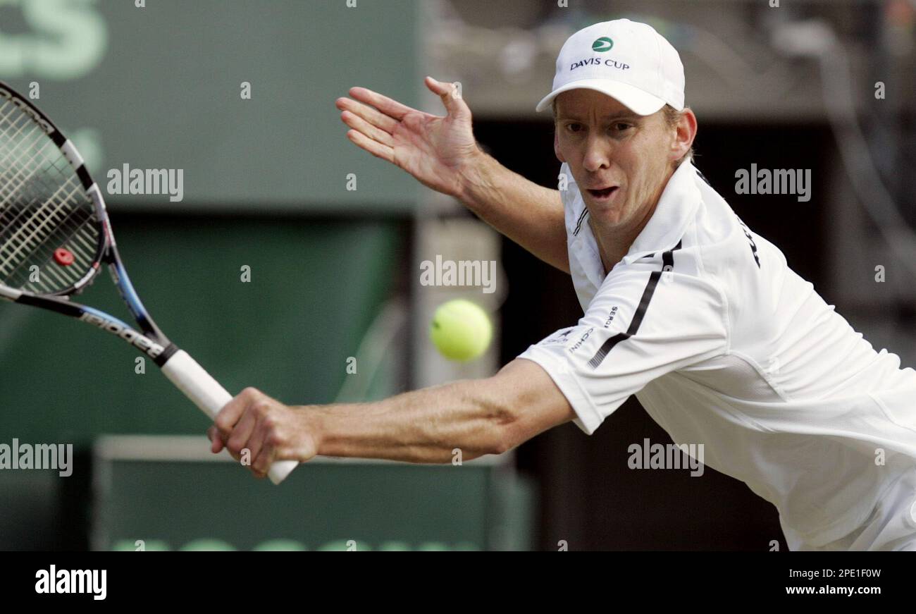 Australia's Wayne Arthurs stretches for a backhand while playing ...
