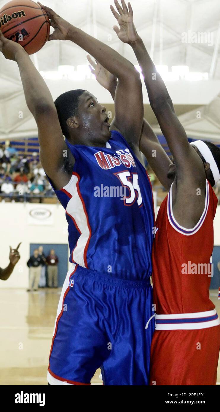 North All Star Derrick Bails (55) shoots over the outstretched arms of ...