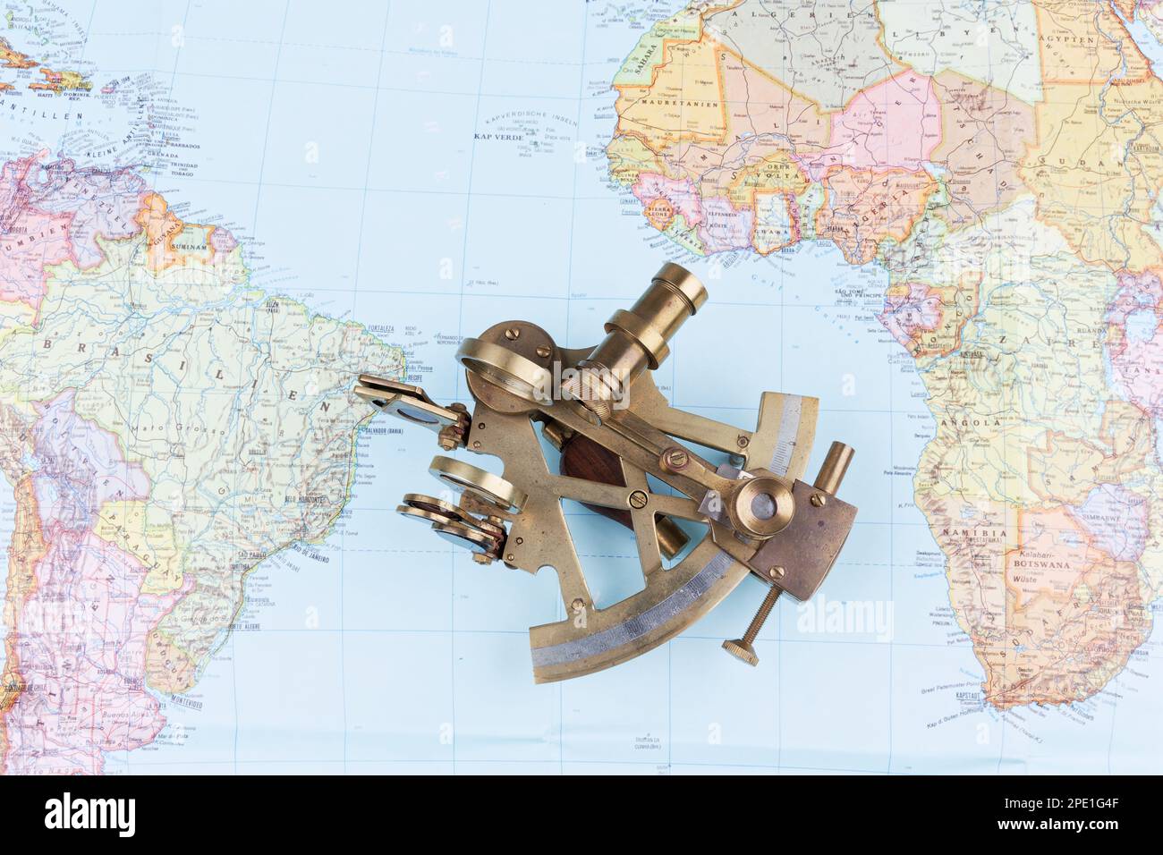 nautical sextant with optics lying on paper world map Stock Photo - Alamy
