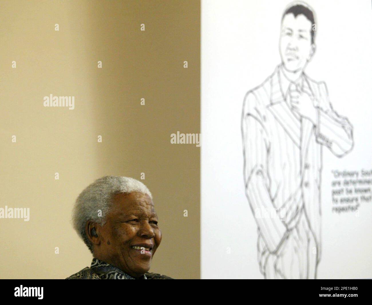 Former South African President Nelson Mandela, alongside an image of ...