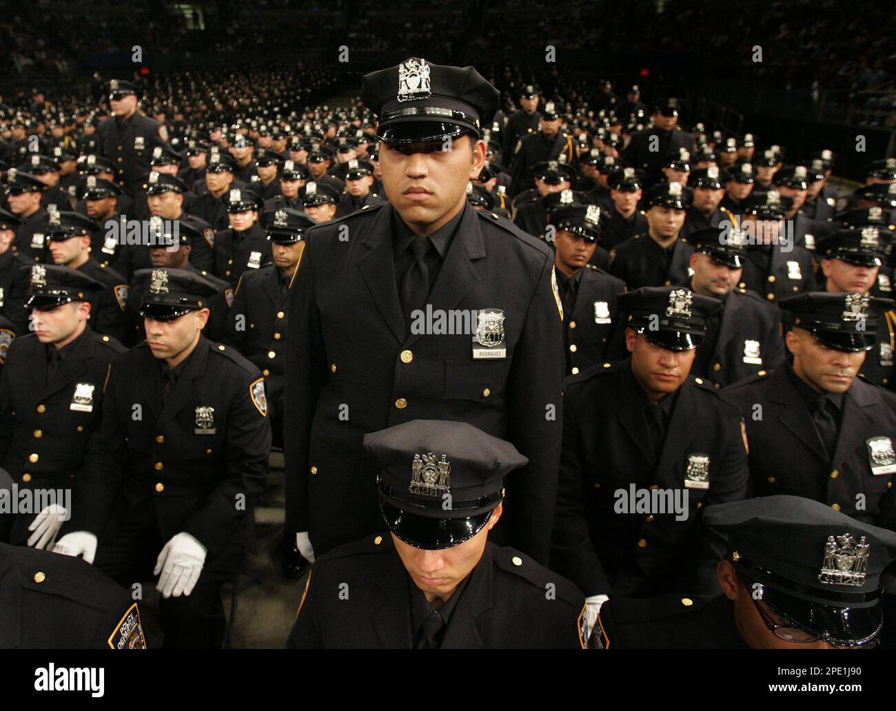 New York City Police Academy cadet graduate Rodriguez stands during the ...