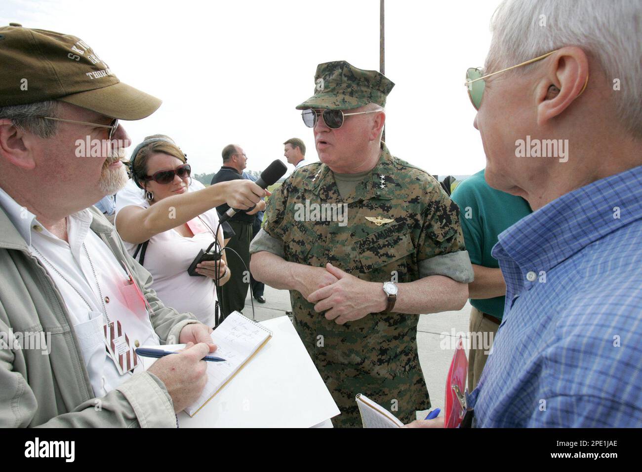 Members of the media interview U.S. Marine Corps Lt. Gen. Mike Hough ...