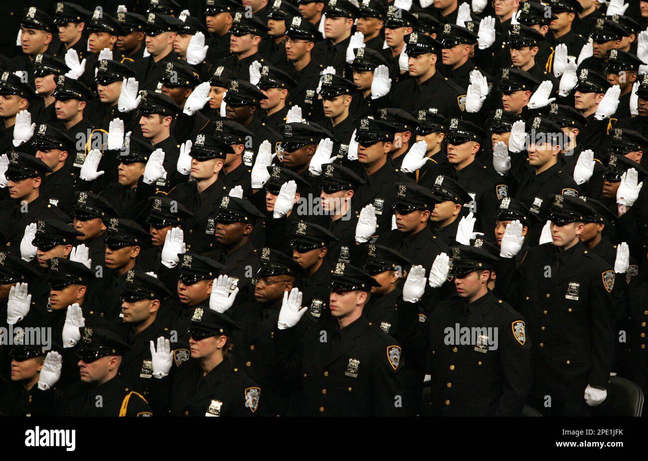 New York City Police Academy graduates take their oath of office during ...
