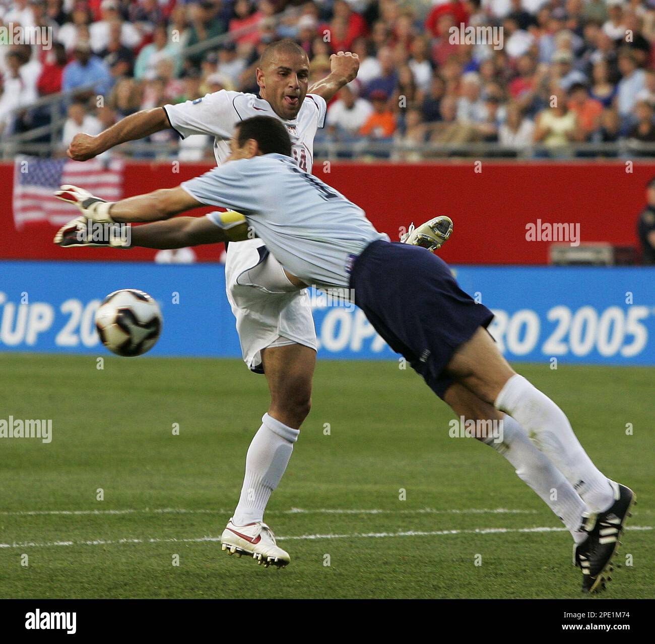Costa Rica goalkeeper Jose Francisco Porras, front, dives to deflect ...