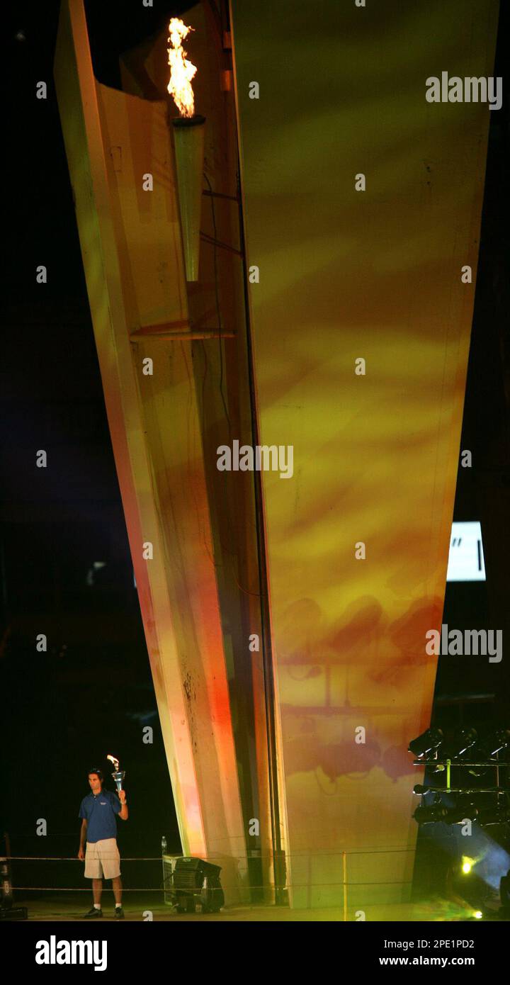 Israeli athletes Gal Friedman holds a torch as the light of the17th ...