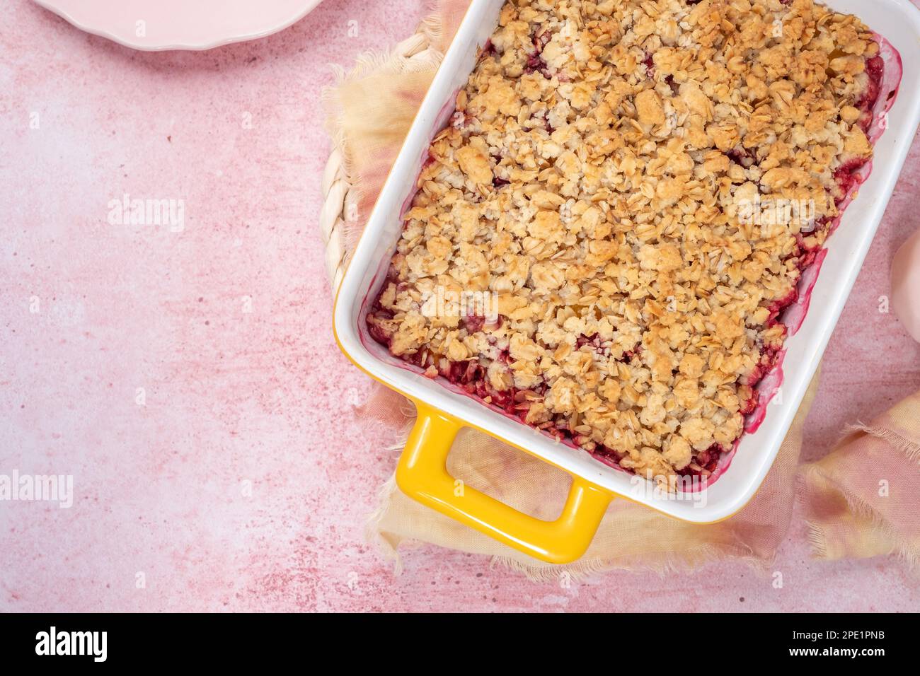 Peach and raspberry crumble cake Stock Photo - Alamy