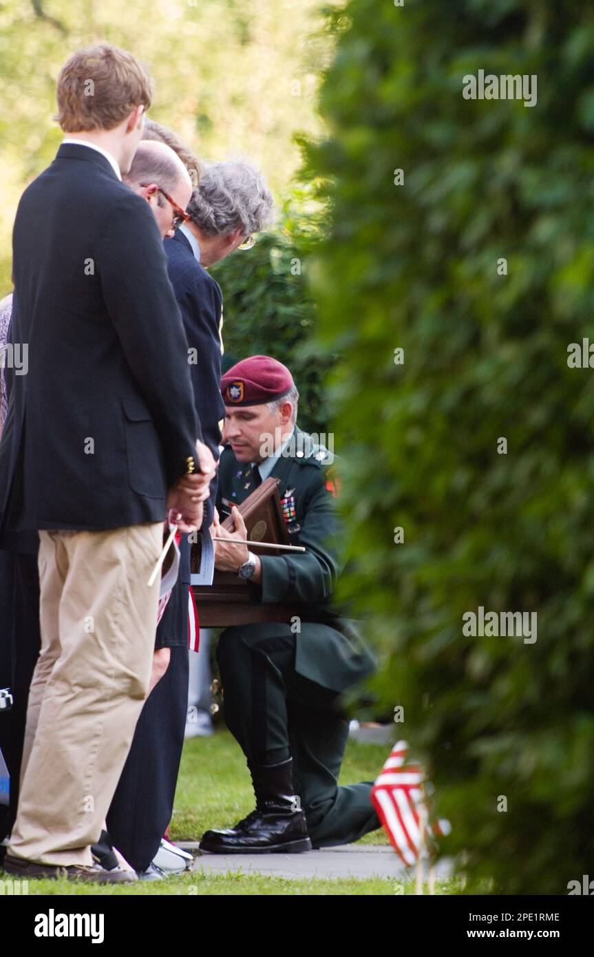 Lt. Col. Manfred Little, right, 3rd Battalion commander, kneels with a ...
