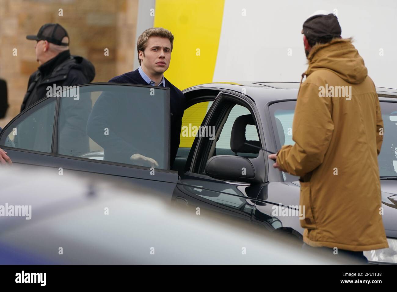Ed McVey gets into a car as he plays the part of Prince William as they ...