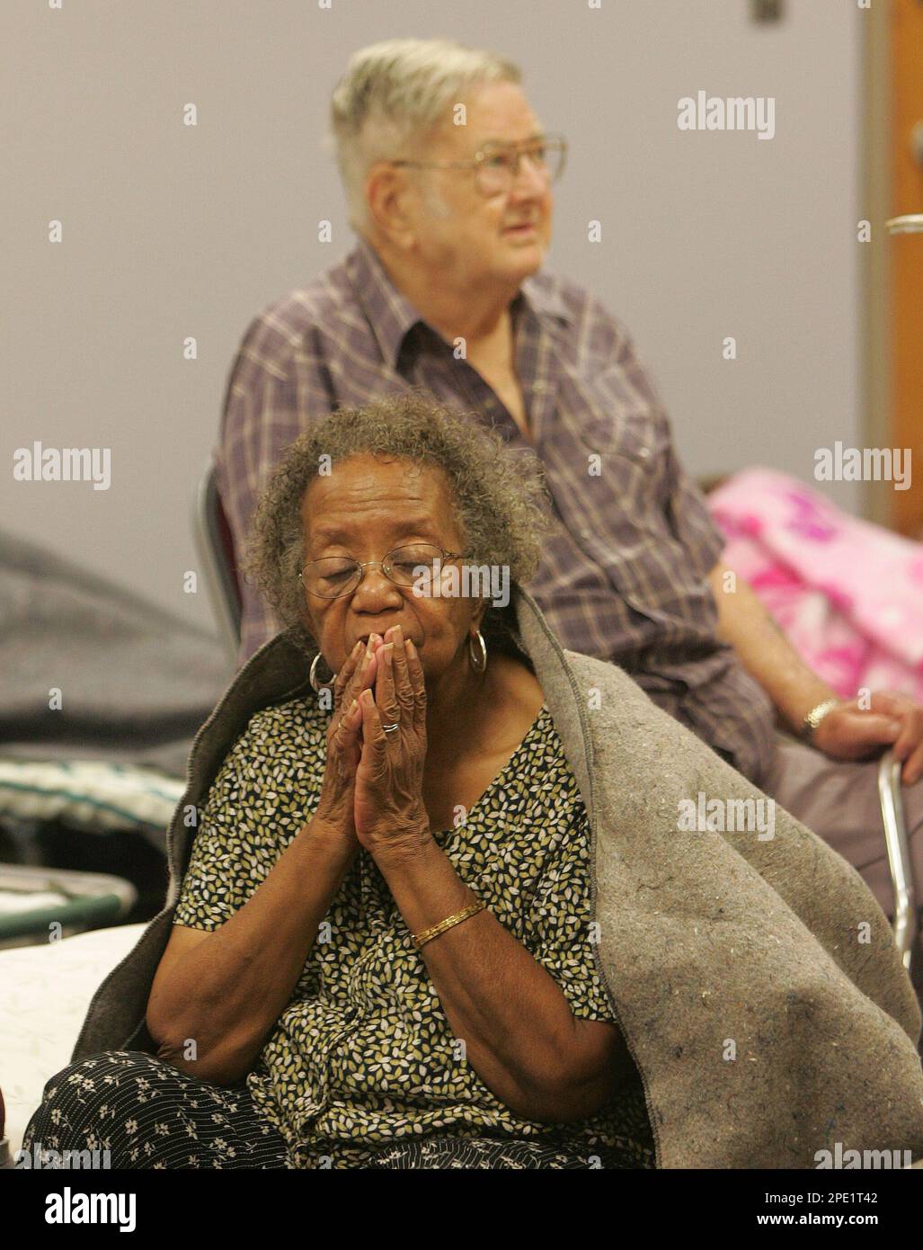 Gwen Lewis and Lesley Hale take refuge from Hurricane Dennis at a ...