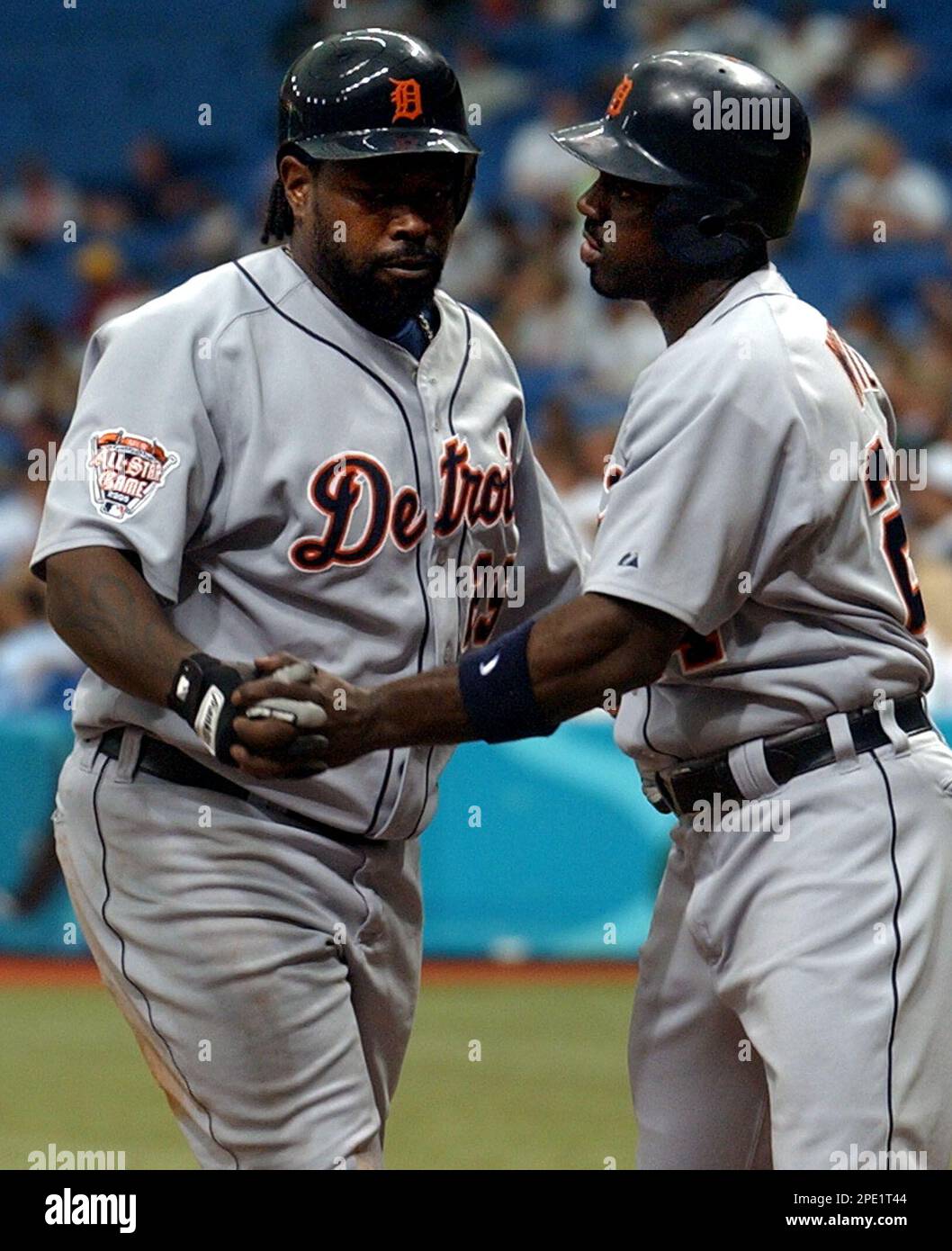 Detroit Tigers' Rondell White, right, greets Dimitri Young at the plate ...