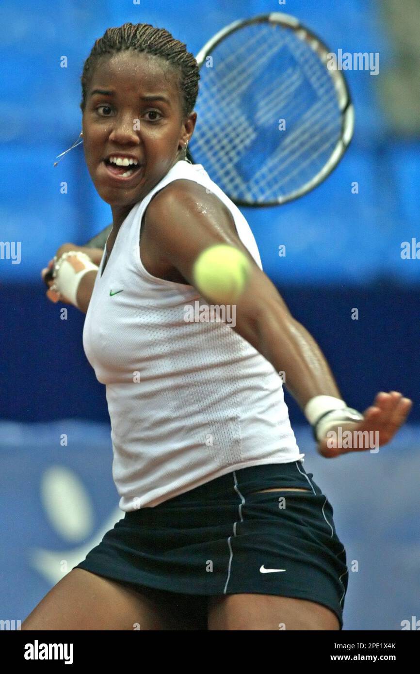 Mashona Washington, of the U.S, returns a shot during her semifinal ...