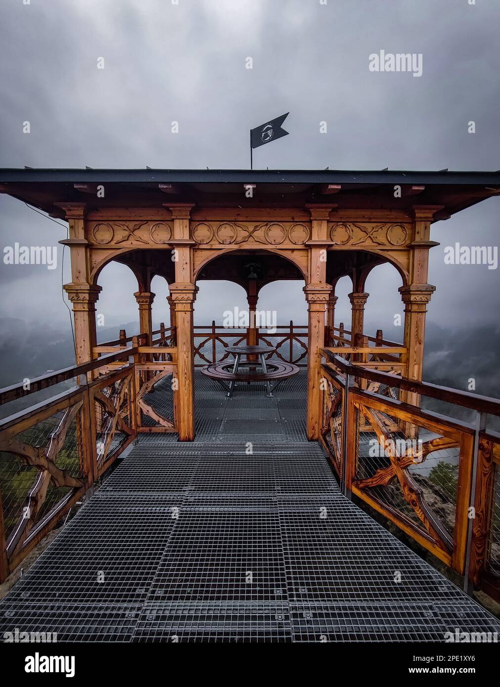 A wooden pavilion stands atop a picturesque mountain pathway Stock ...