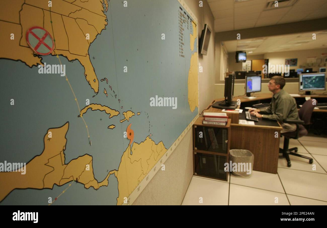 Hurricane specialist Richard Knabb, right, works on a computer ...