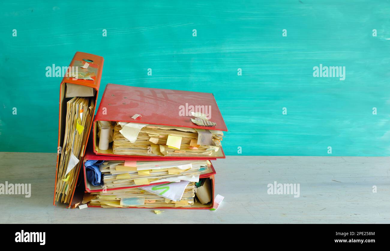 Messy file folders, red tape, bureaucracy, business concept, free copy ...