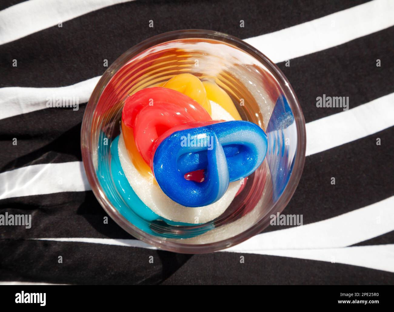 Various toothpaste of many colors squeezed into a cup. Delicious ...