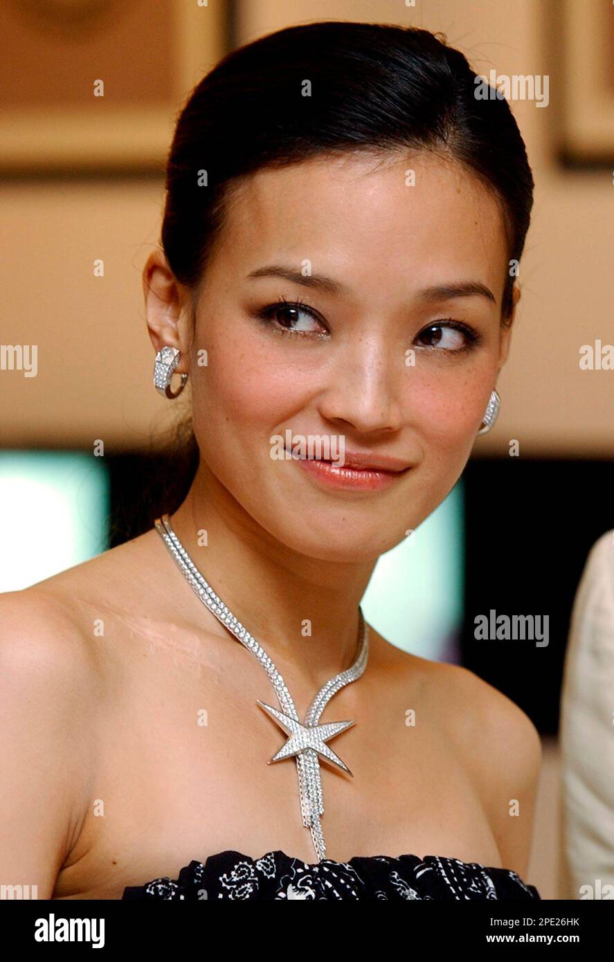 Taiwanese actress Shu Qi smiles during a grand opening ceremony Tuesday ...