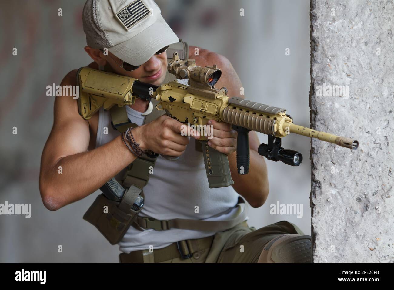 Ukrainian soldier aiming the target with assault rifle scope. Strong ...