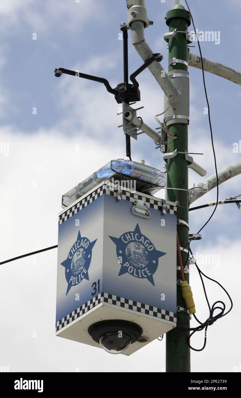 A Chicago Police Department surveillance camera is seen mounted on a ...