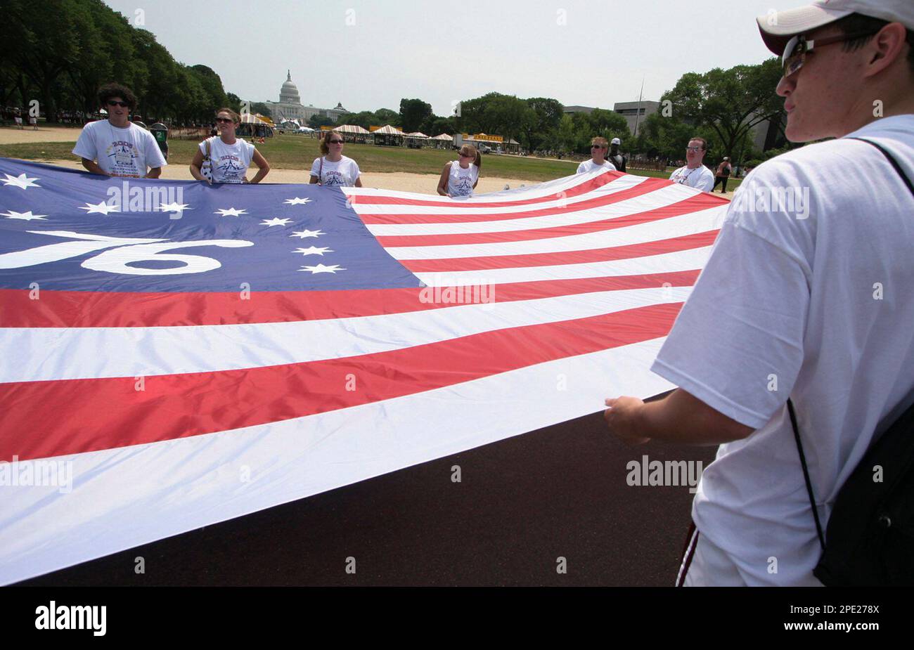 A group of volunteers from the National Youth Leaders Conference hold a ...