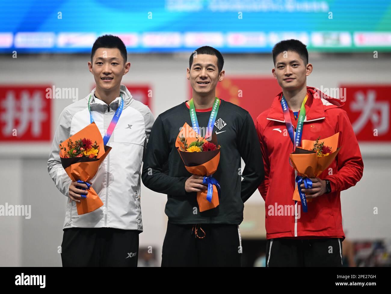 Tianjin, Wang Jianan (L) and bronze medalist Zhang Mingkun pose for photos during the awarding ...