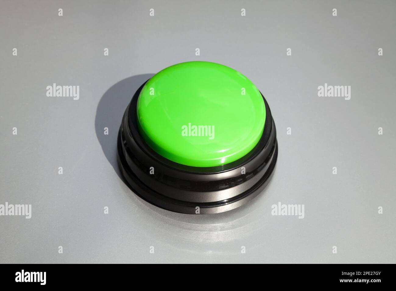 Big green buzzer for answers in a game show isolated on gray. Wireless ...