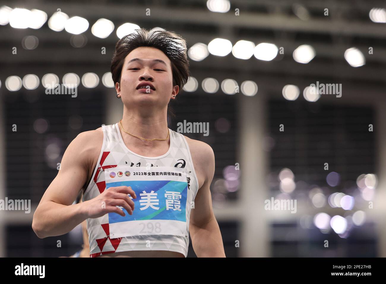 Tianjin. 15th Mar, 2023. Huang Meixia competes during the women's 60m ...
