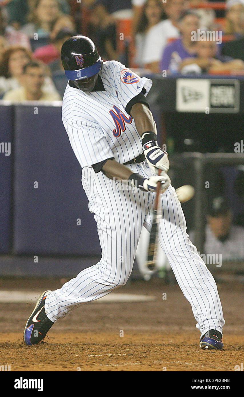 New York Mets' Mike Cameron drives a double against Florida Marlins ...