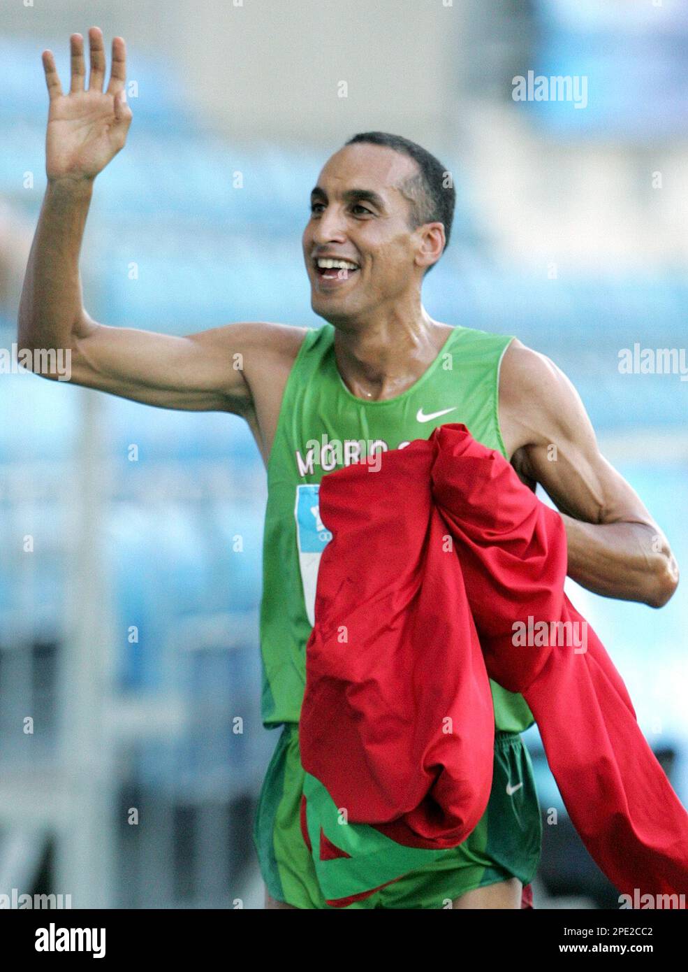 Brahim Boulami of Morocco waves after winning the men's 3,000 meters ...