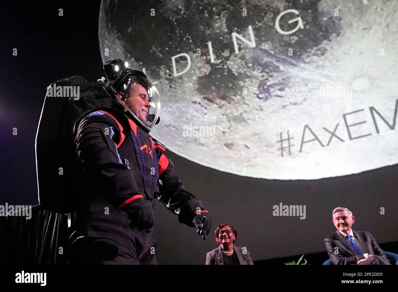 Axiom Space chief engineer Jim Stein demonstrates a prototype spacesuit ...