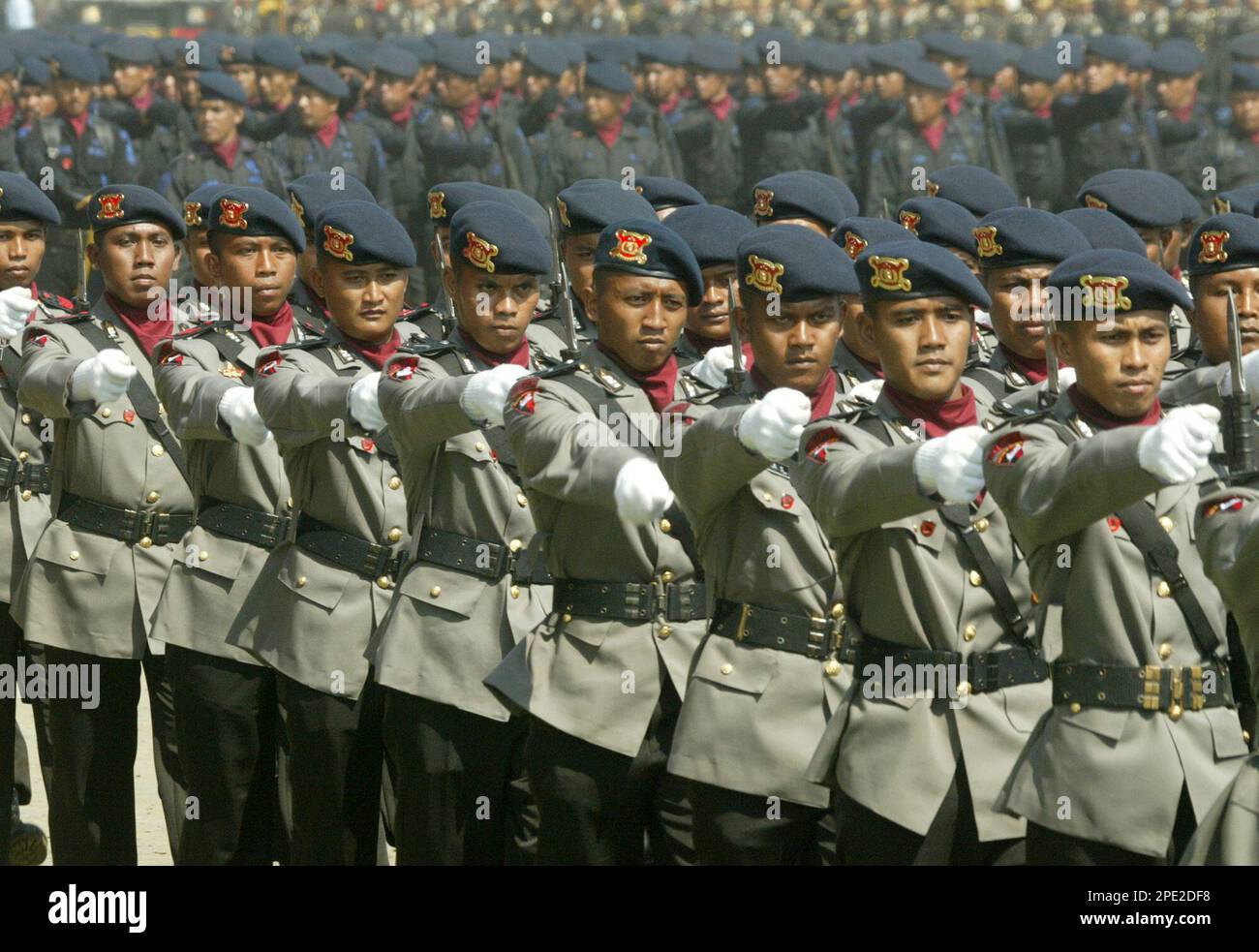 Indonesian Police officers march during a ceremony commemorating the ...