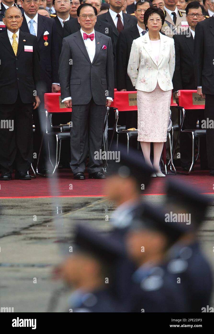 Hong Kong's new leader Donald Tsang, second from left, and his wife ...