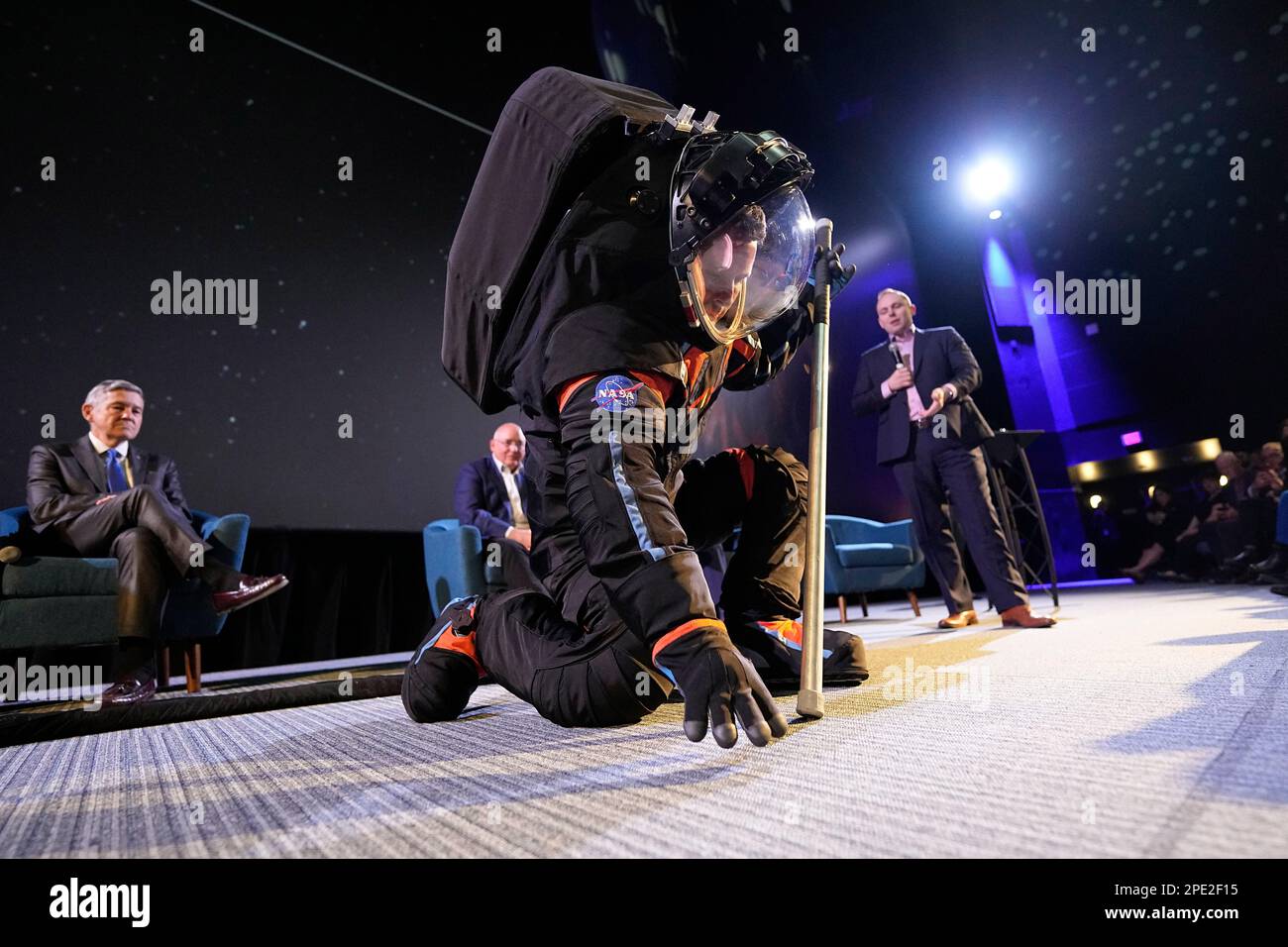 Axiom Space chief engineer Jim Stein demonstrates a prototype spacesuit ...
