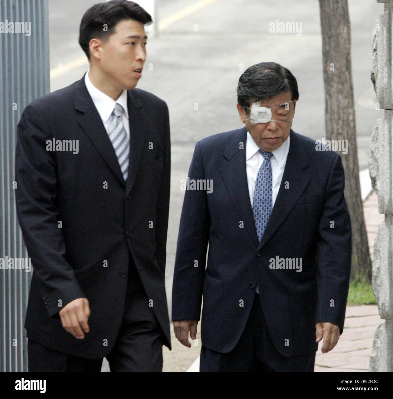 Kim Un-yong, right, former vice president of the International Olympic ...