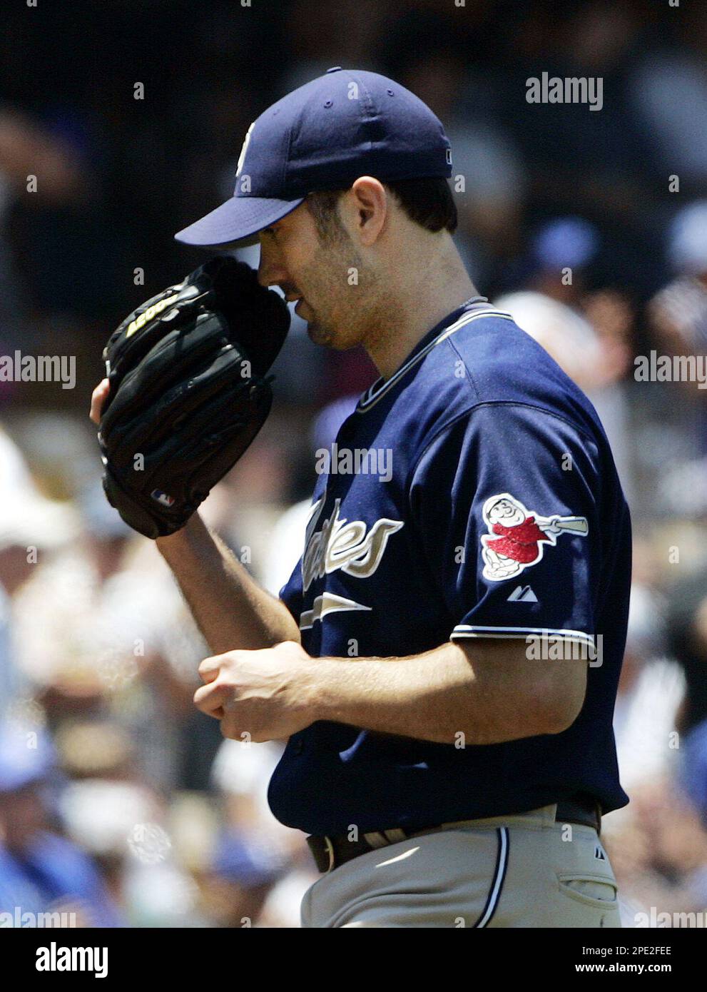 San Diego Padres' pitcher Darrell May covers his face after giving up a ...