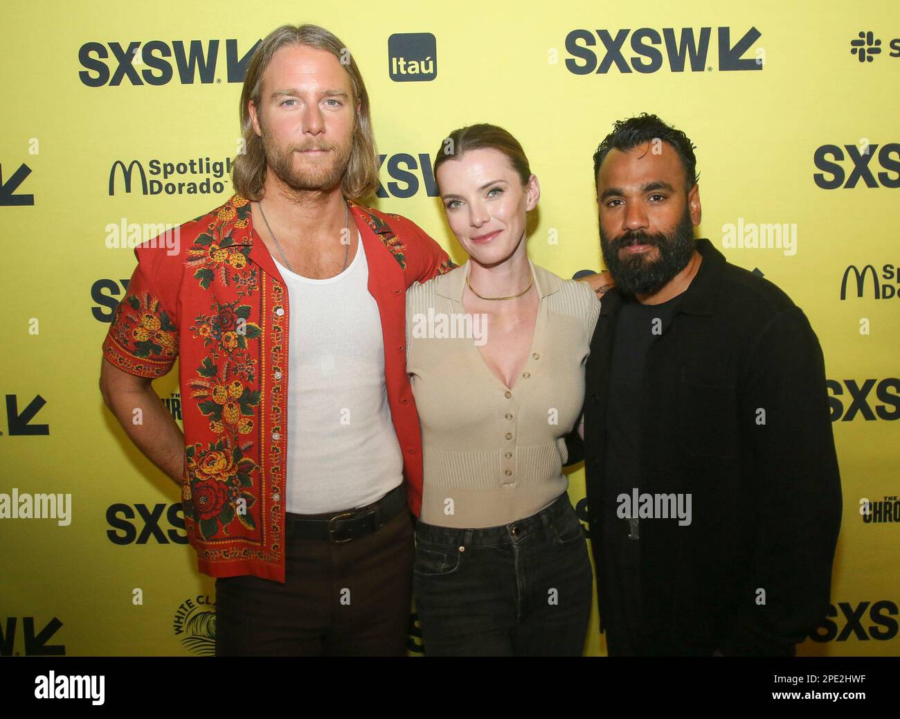 Jake McDorman, Betty Gilpin and Andy McQueen, from left, arrive for the ...