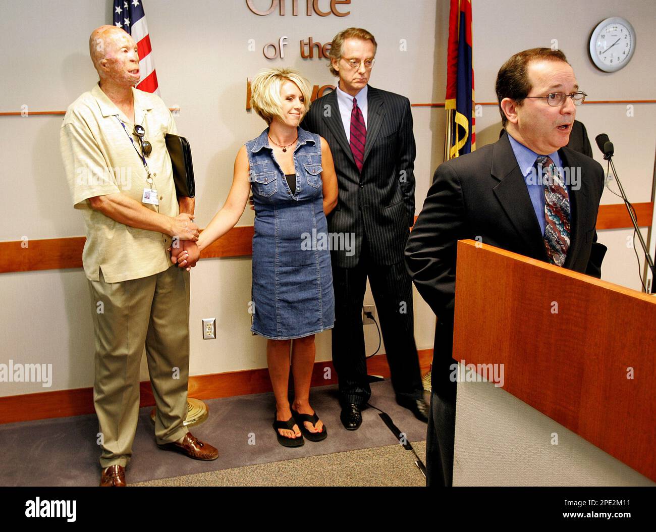 Phoenix Police Officer Jason Schechterle, left, his wife Suzie ...
