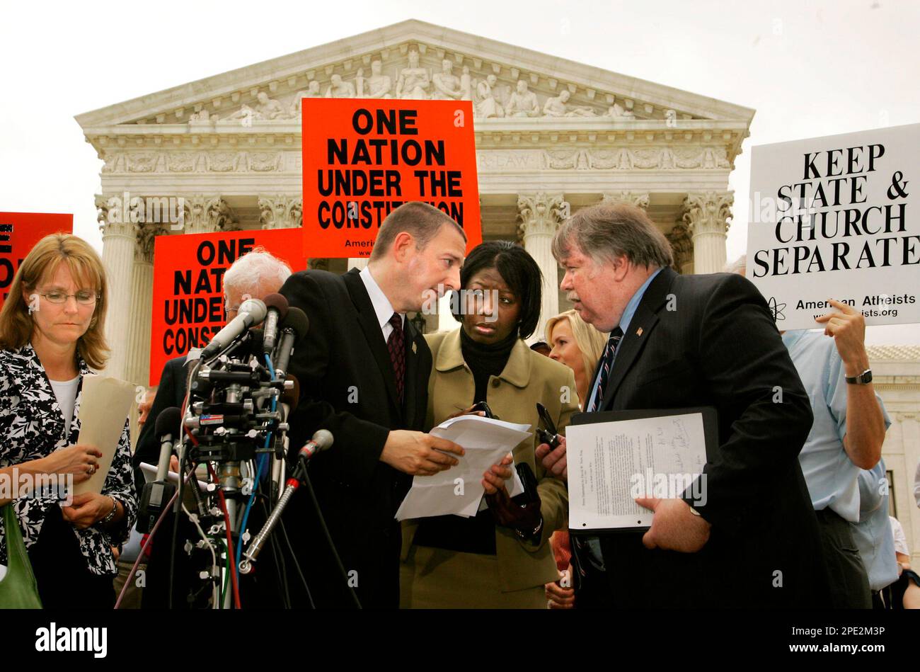 Rev. Rob Schenck, president of Faith and Action, center, confers with ...