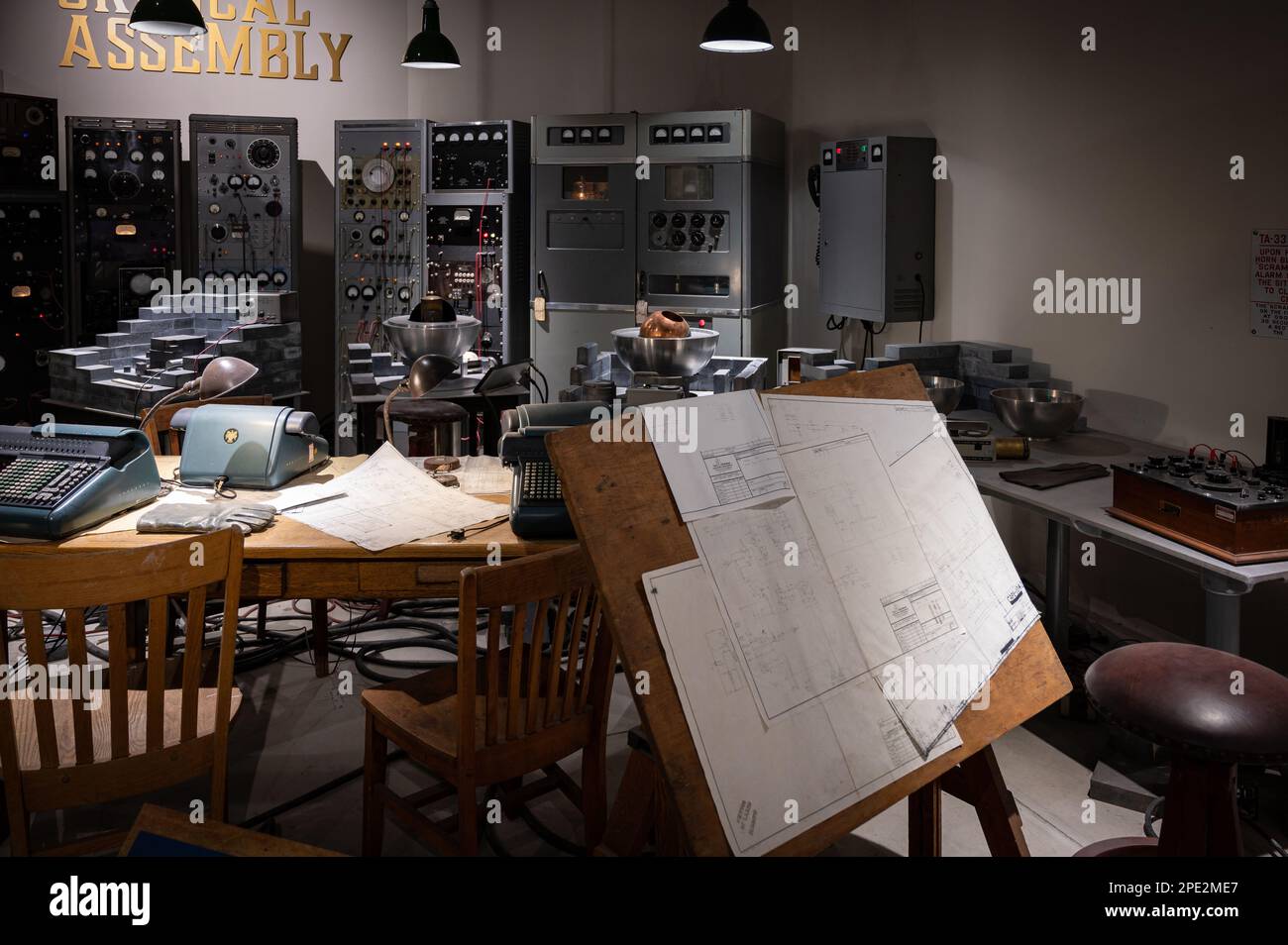 An interior view of a old office laboratory space, table surrounded by ...