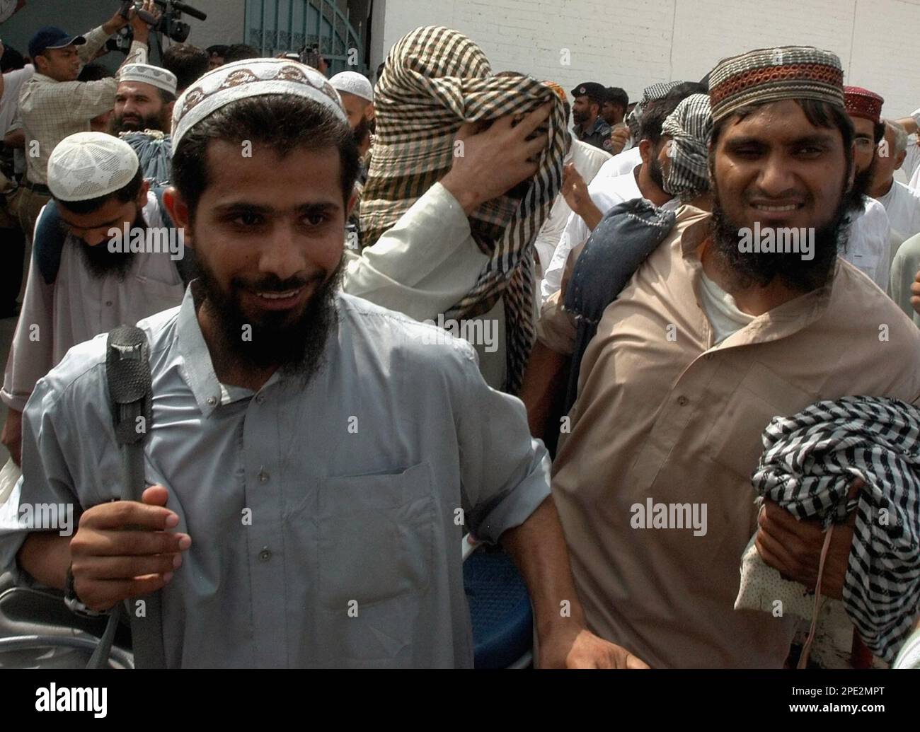 Released prisoners smile as they leave from Kot Lakput, a prison, in ...