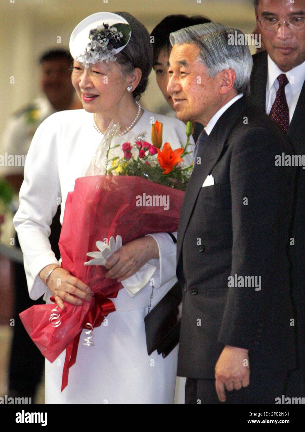 Japanese Emperor Akihito, right, accompanied by Empress Michiko, left ...
