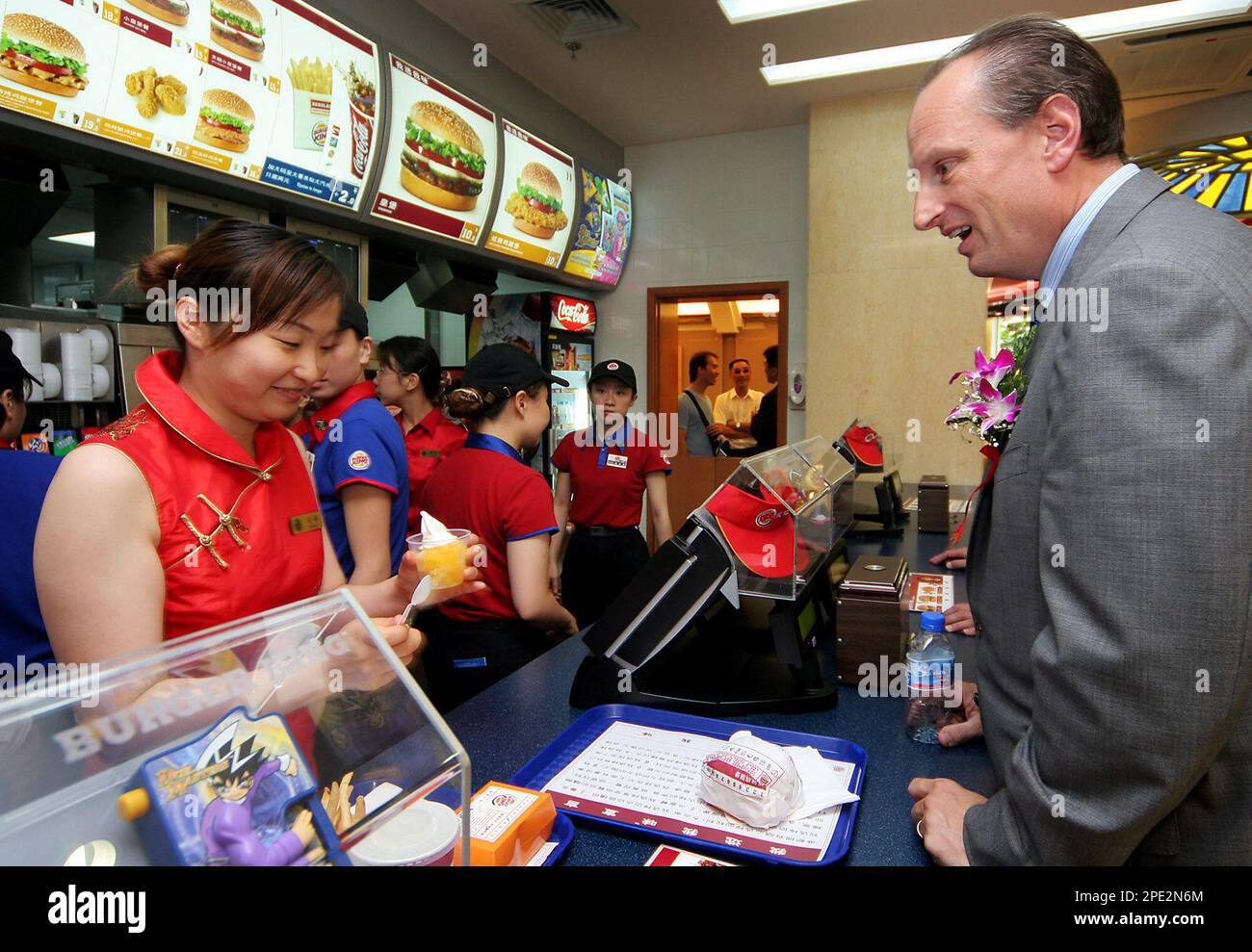 Greg Brenneman, right, chairman and CEO of the Burger King Corp. is ...