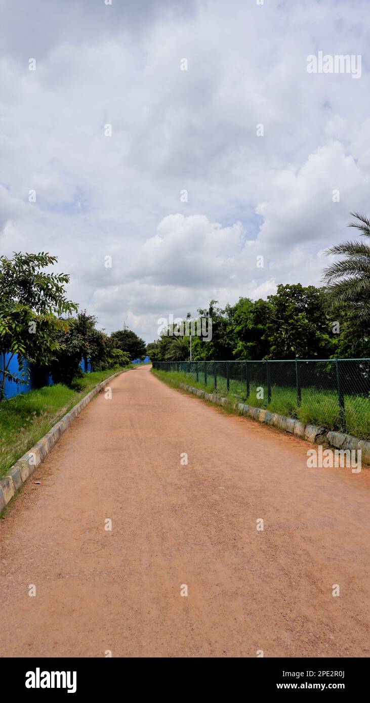 Portrait view of walking lane of Agara lake. Well maintained lakes and ...