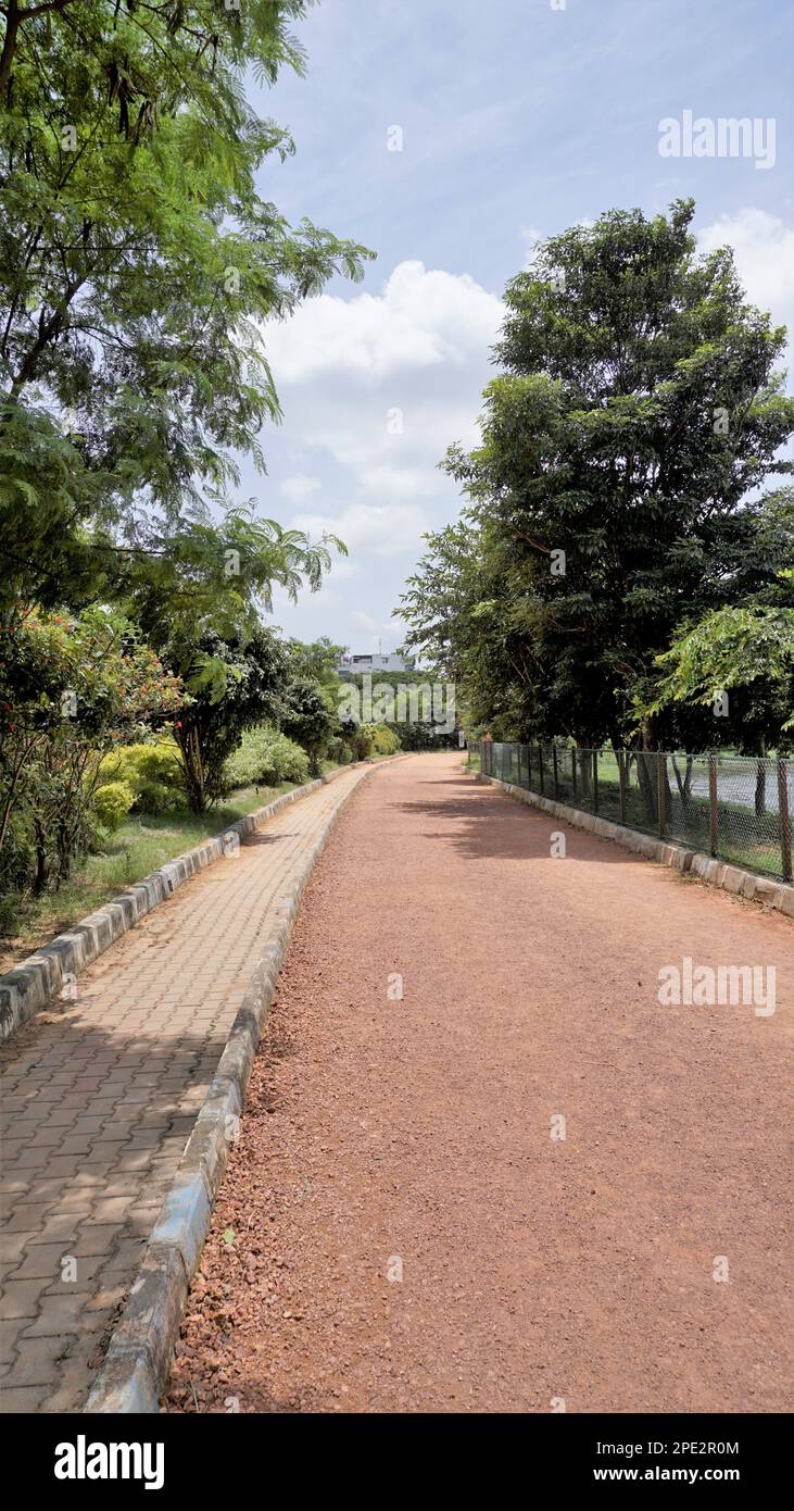 Portrait view of walking lane of Agara lake. Well maintained lakes and ...