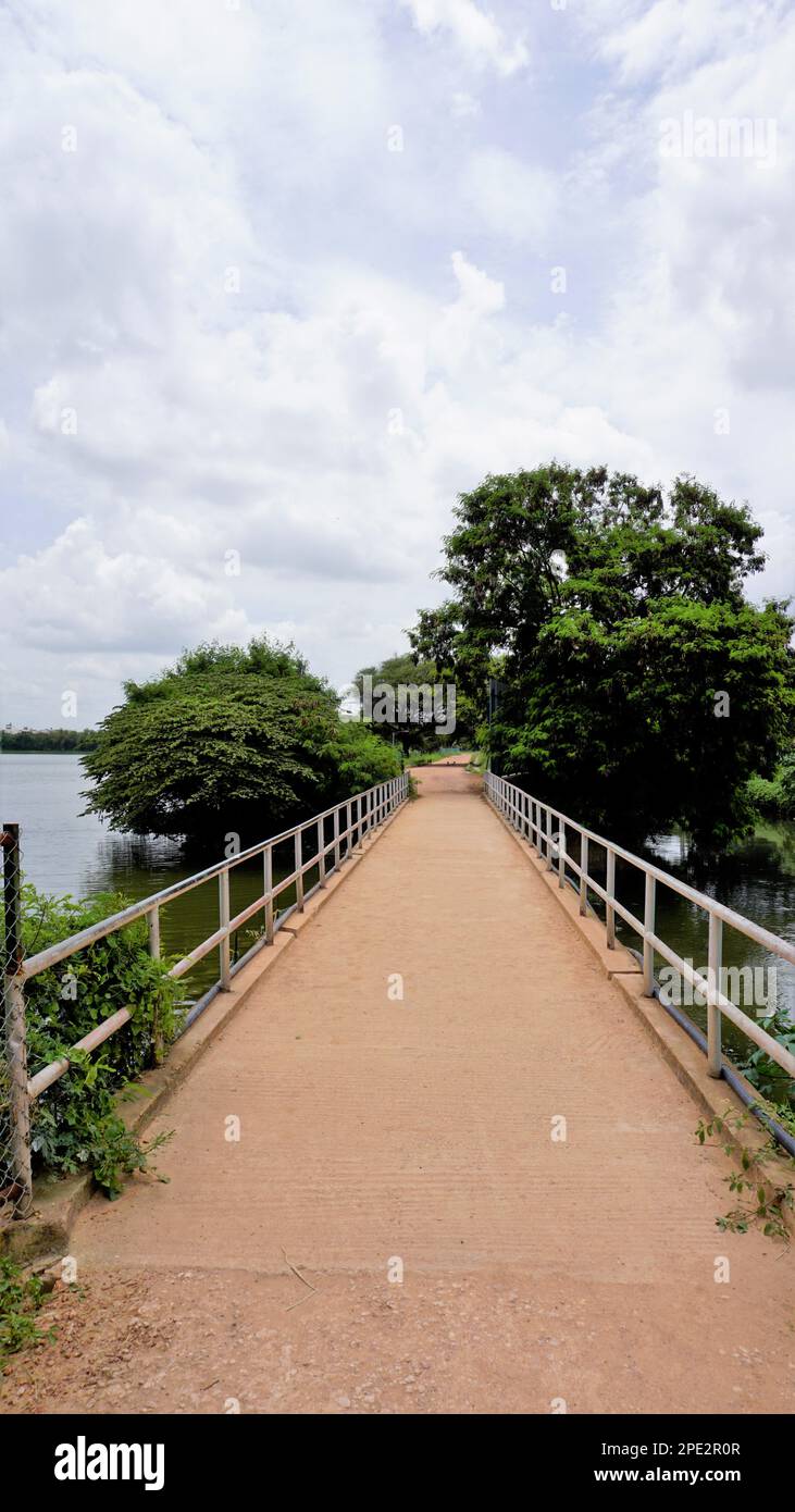 Portrait view of walking lane of Agara lake. Well maintained lakes and ...