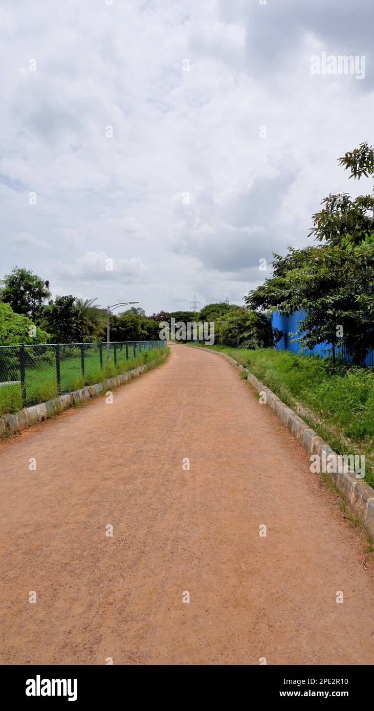 Portrait view of walking lane of Agara lake. Well maintained lakes and ...
