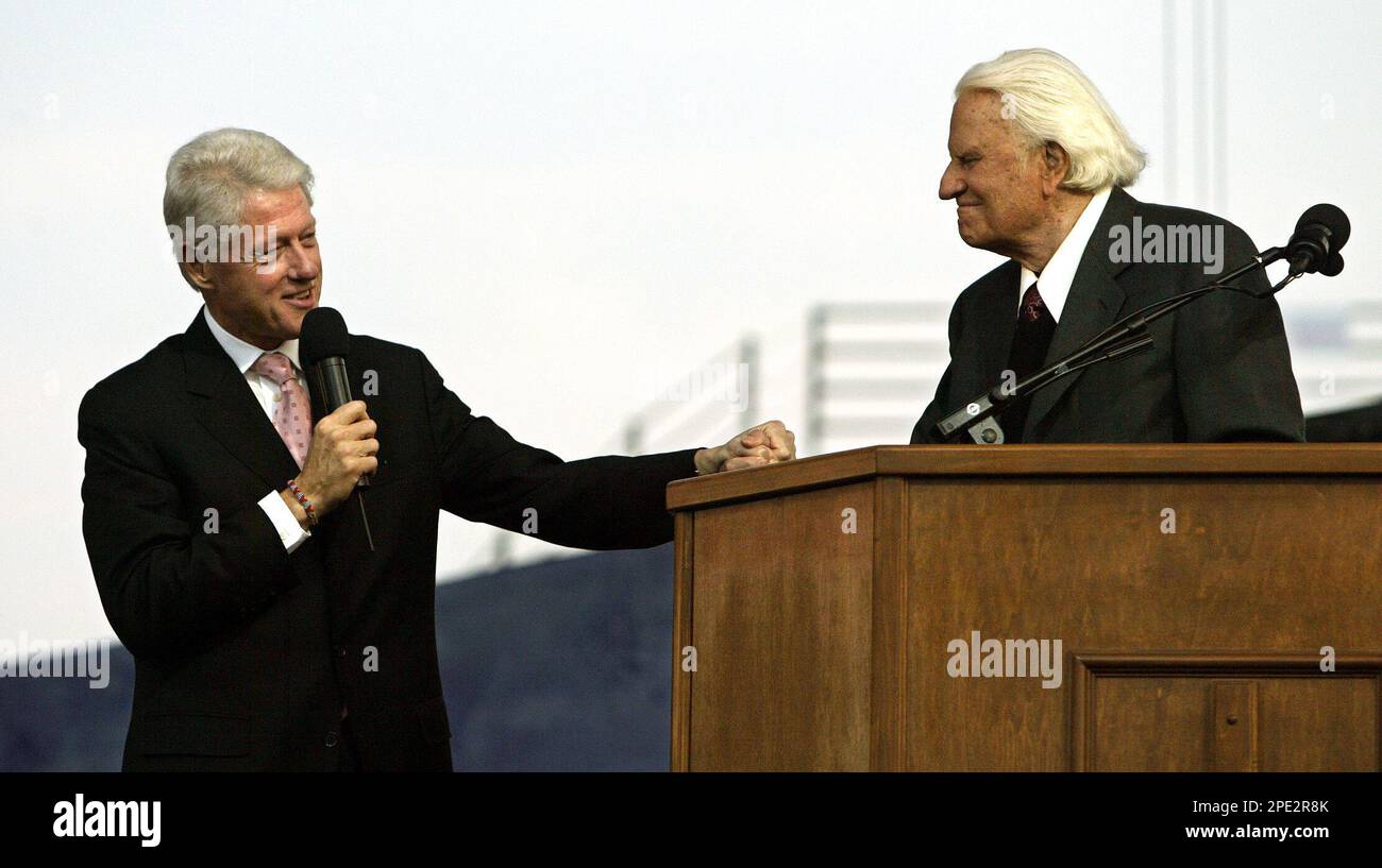 Former president Bill Clinton, left, greets Billy Graham during the ...