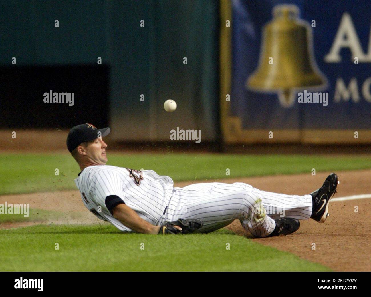 Houston Astros right fielder Jason Lane goes for a foul ball hit by ...