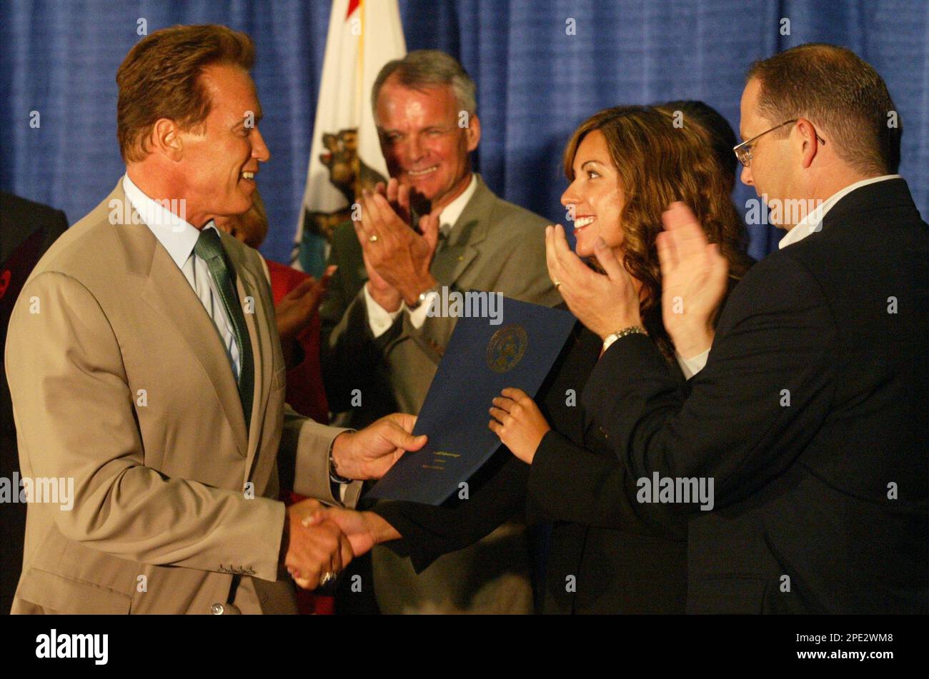 California Gov. Arnold Schwarzenegger, left, presents California ...